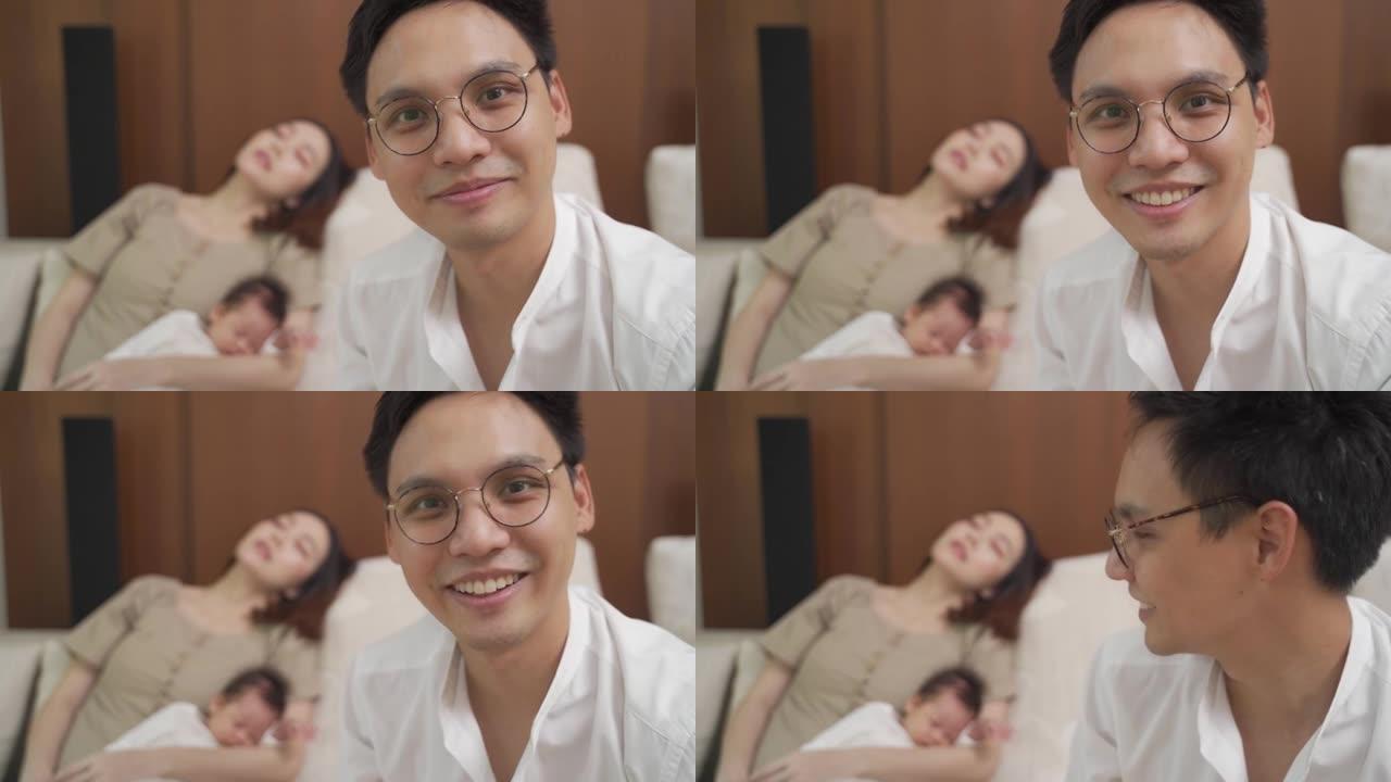 疲惫的亚洲家庭与新生婴儿成员。快乐而微笑的亚洲父亲，母亲和婴儿在家里的客厅背景下睡觉。父亲对家庭工作视频素材下载编号16300454光厂vj师网